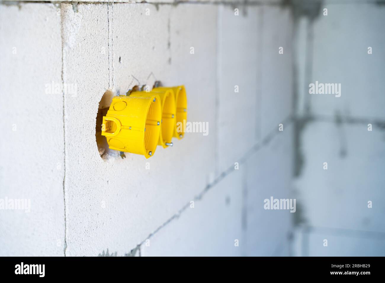 Yellow plastic recessed sockets, installation box for a socket in an ...