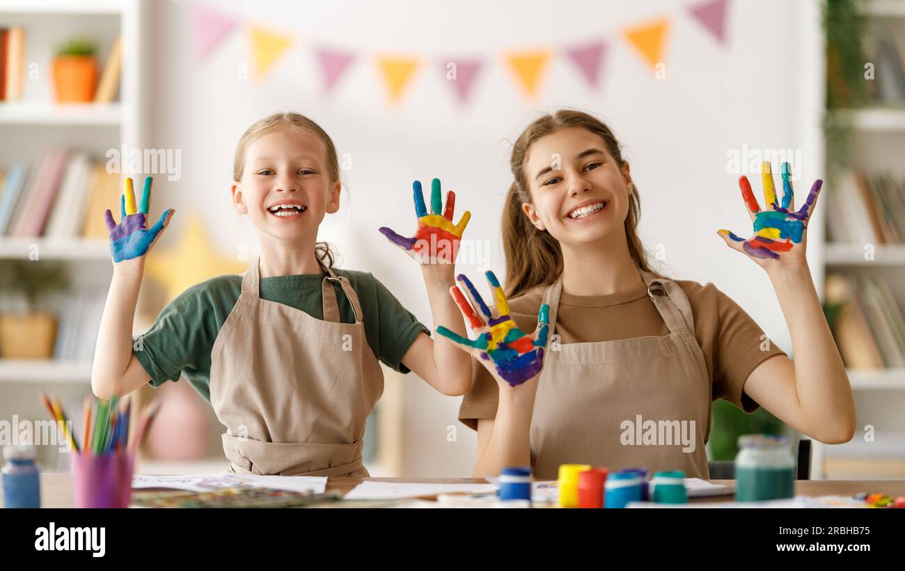 Happy kids at the art class. Children are painting together Stock Photo ...