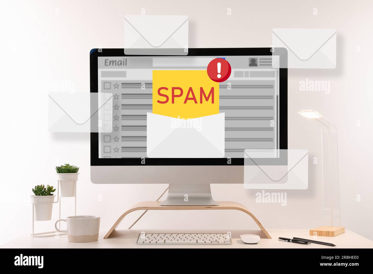 Spam warning message in email software. Envelope illustrations popping out of computer display ...
