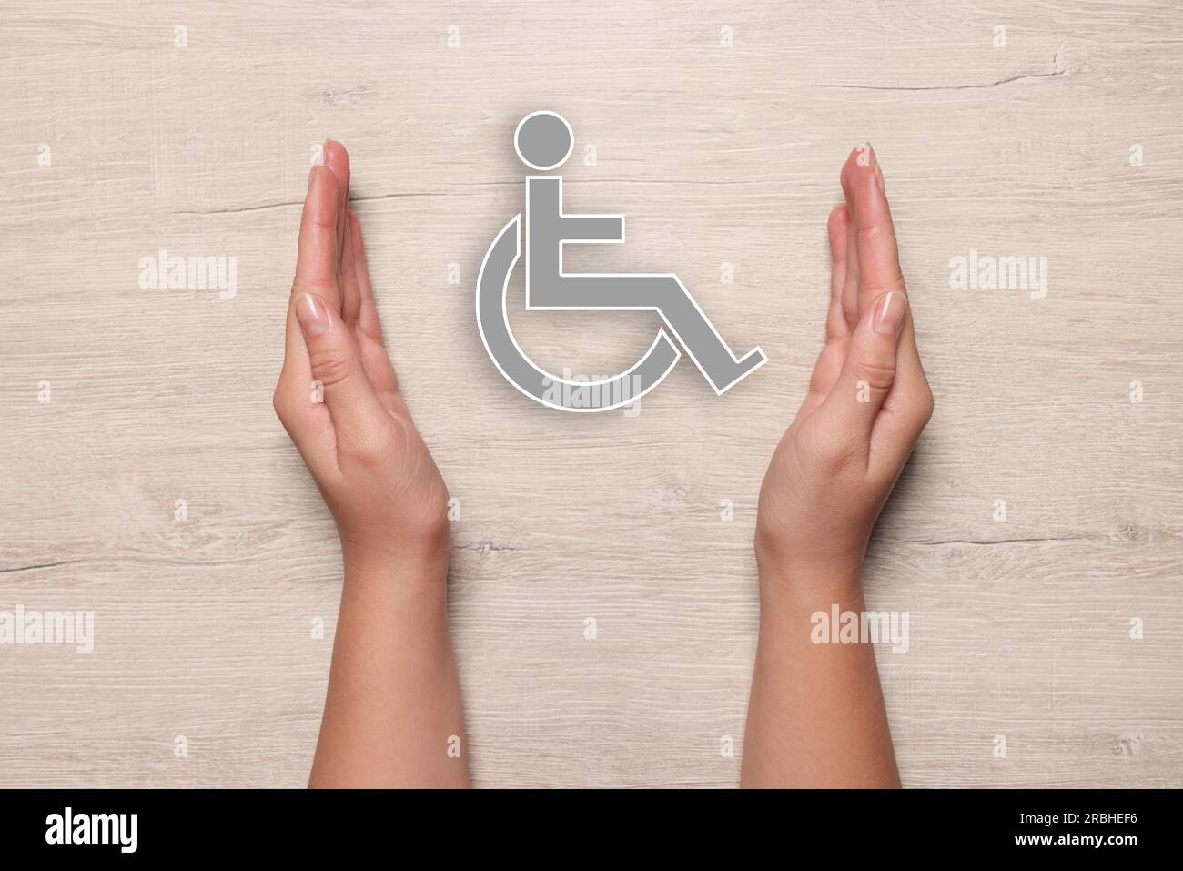 Disability inclusion. Woman protecting wheelchair symbol on white ...
