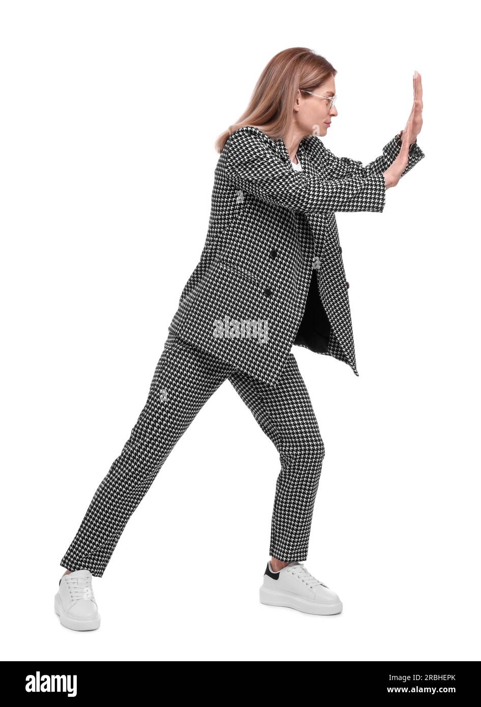Attractive businesswoman pushing something hi-res stock photography and ...