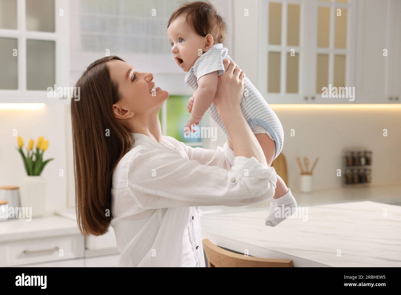 Baby in kitchen hi-res stock photography and images - Alamy