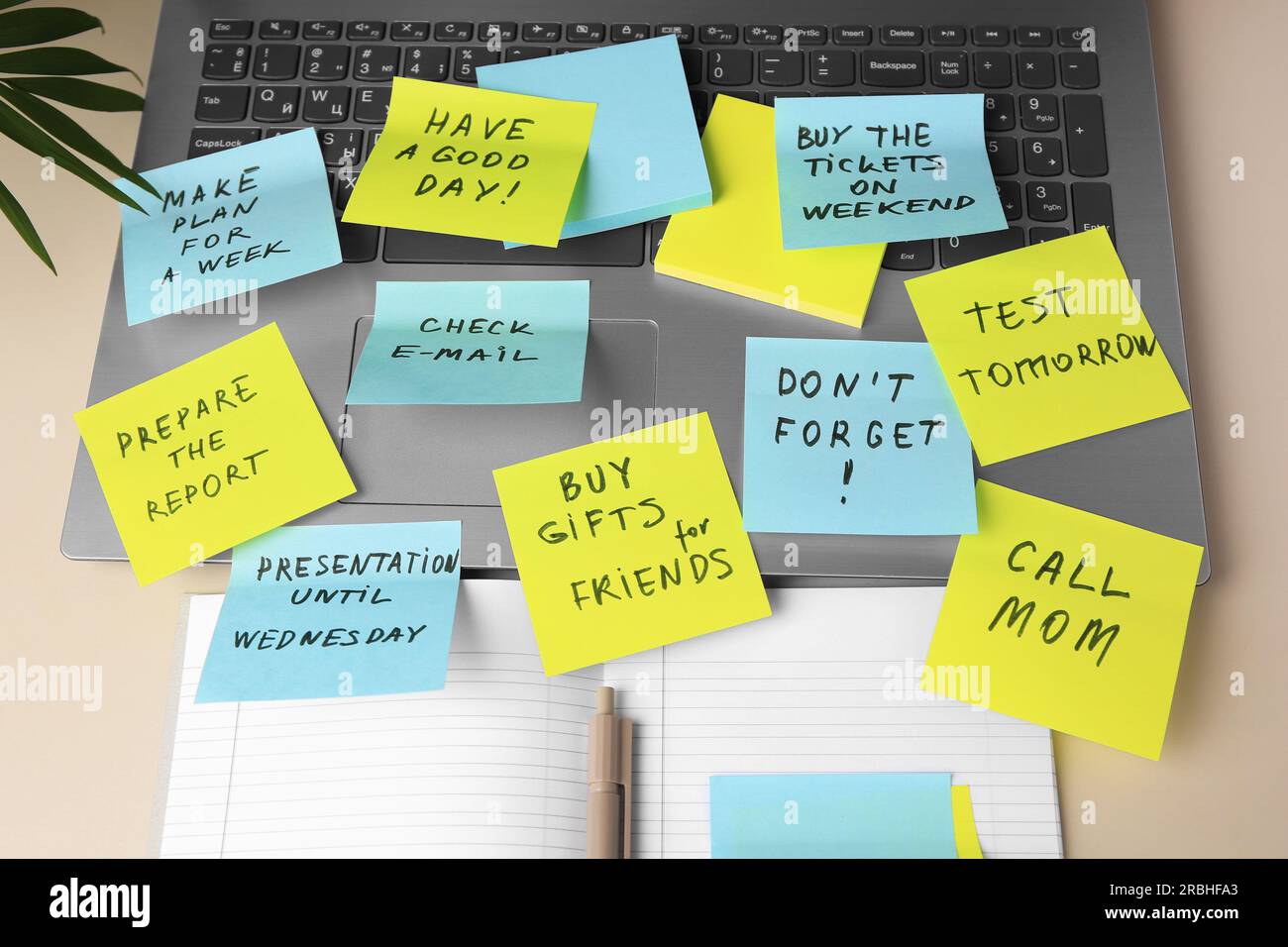 Different reminder notes and laptop on white table Stock Photo - Alamy