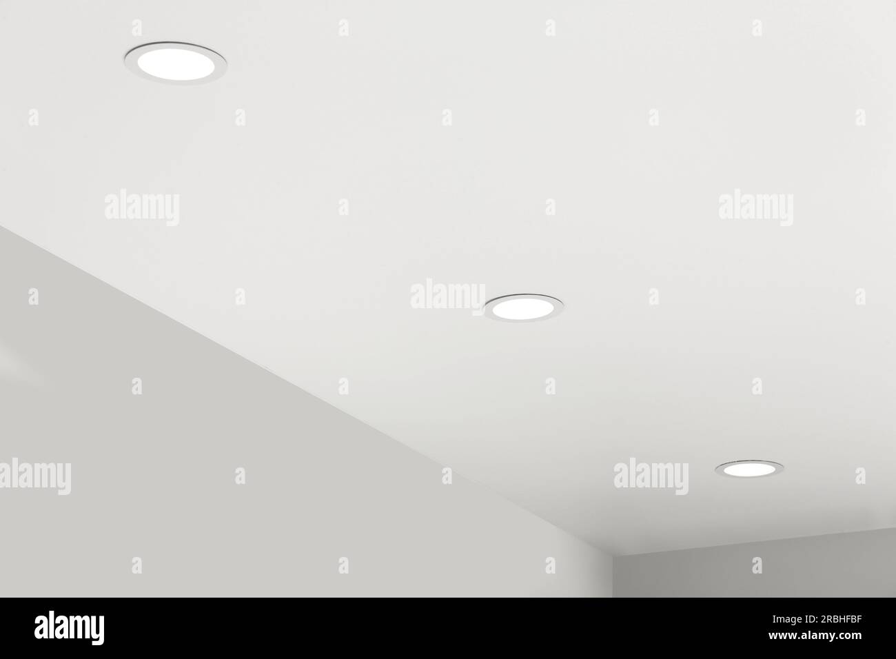 White ceiling with modern lighting in room Stock Photo - Alamy