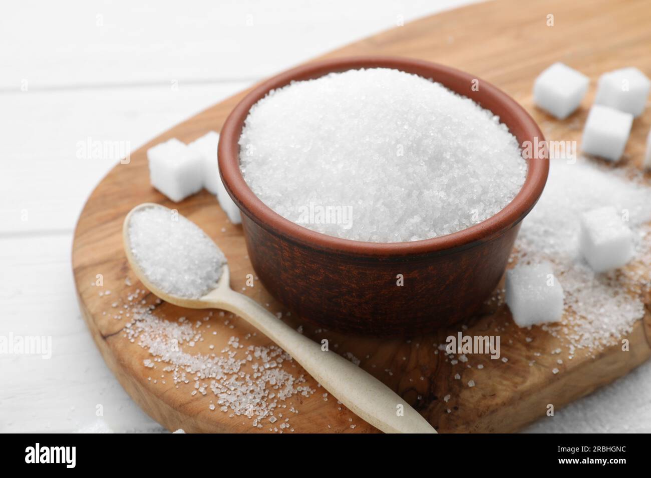 Different types of sugar on white wooden table, closeup Stock Photo - Alamy