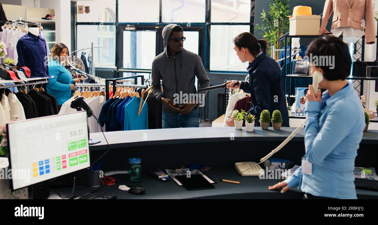 African american robber trying stole stylish shirt being caught by ...