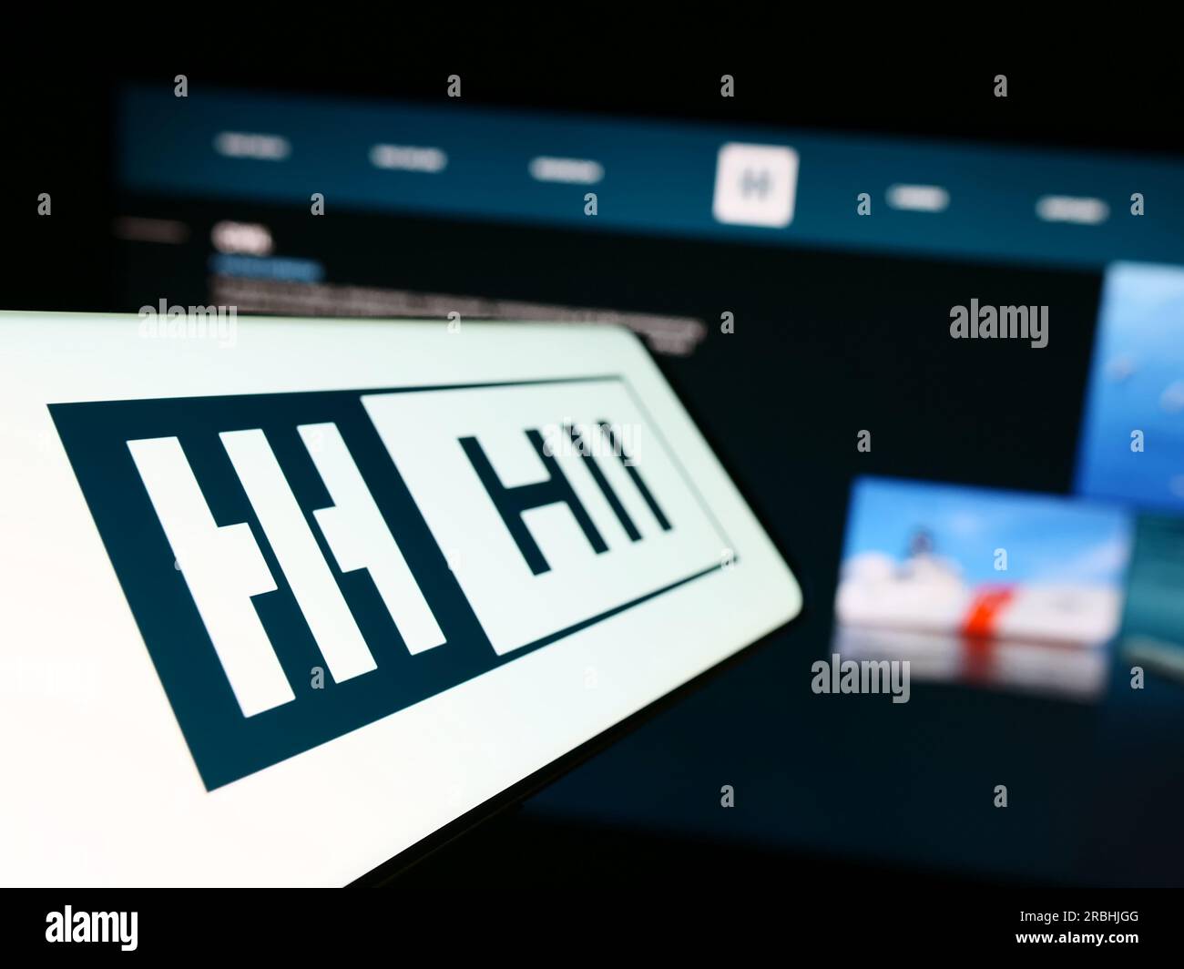 Cellphone with logo of American shipbuilding company HII Corporate on ...