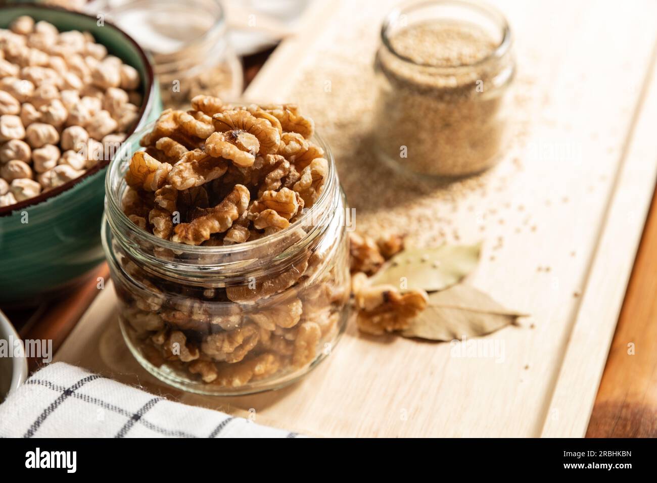 small jar with mixed nuts on rustic table top view. Healthy food and ...