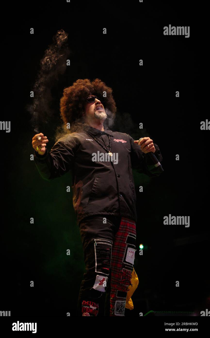 B-Real of Cypress Hill performs on stage sporting sunglasses, a large ...