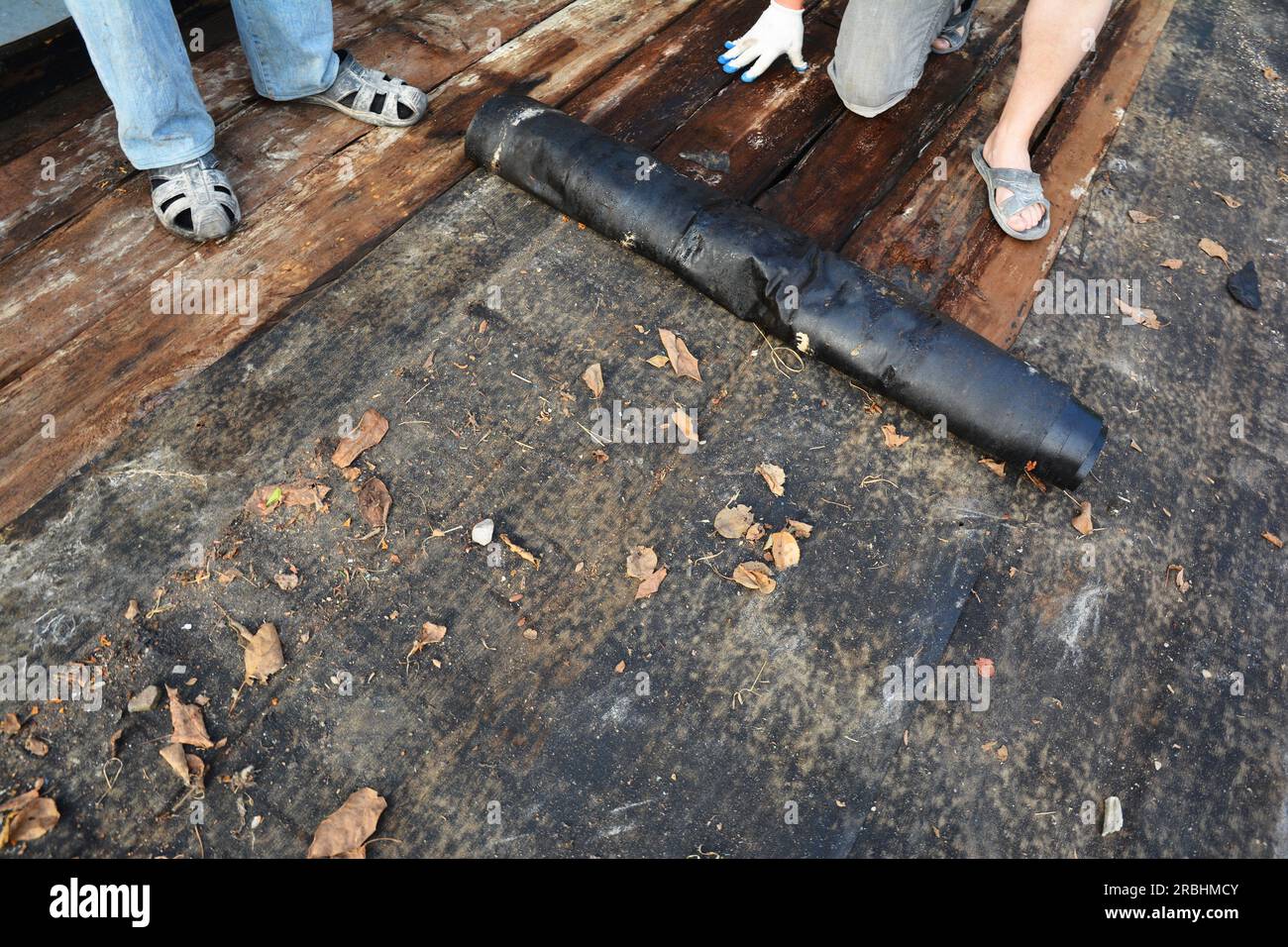 Repairing a run down, old and bad roof sheathing by removing old wet ...