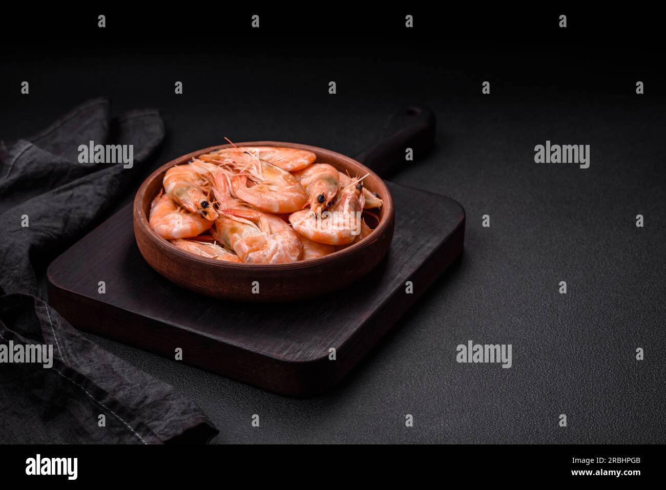 Delicious fresh boiled tiger prawns with salt and spices on a ceramic ...