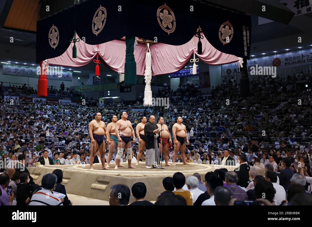 Japan Sumo Association chief Hakkaku (front) delivers a speech on the ...