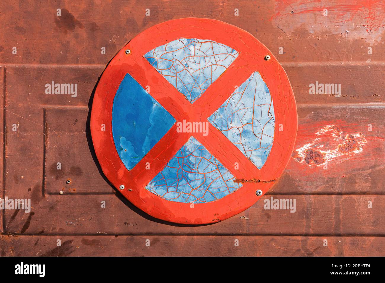 Worn No parking and stopping traffic sign on rusty metal surface, copy ...