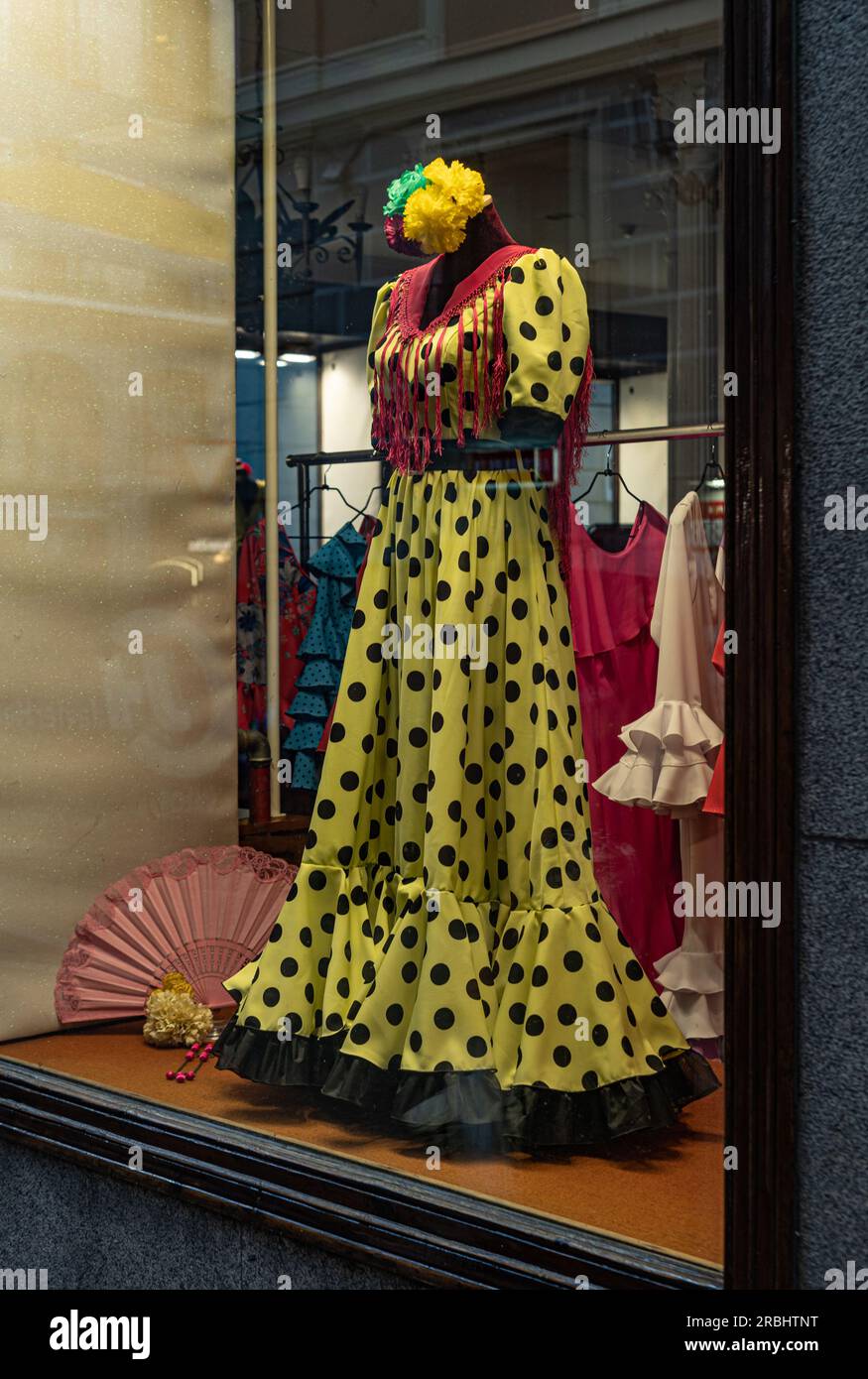 Beautiful spanish flamenco dress in the showcase Stock Photo - Alamy