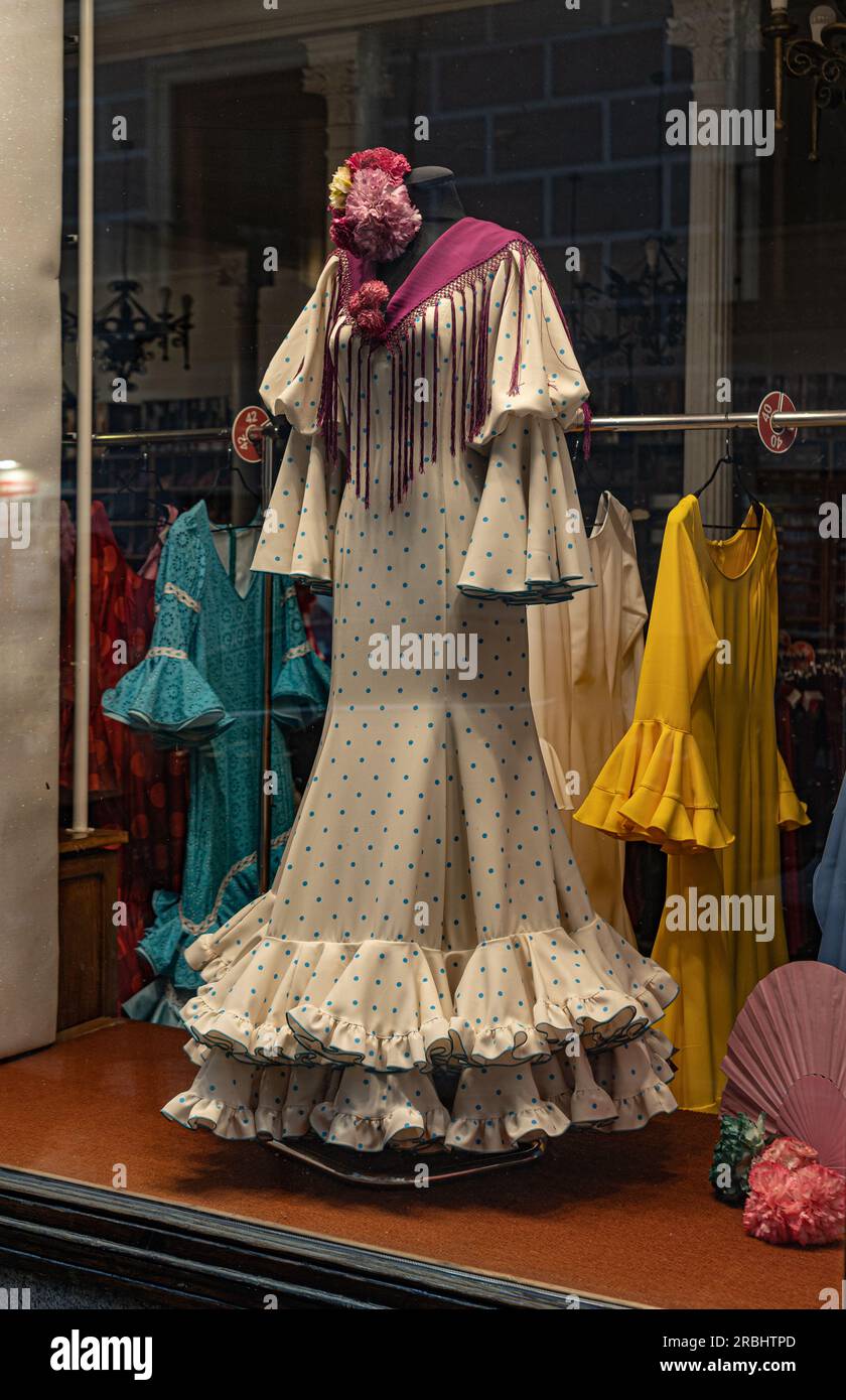 Beautiful spanish flamenco dress in the showcase Stock Photo - Alamy