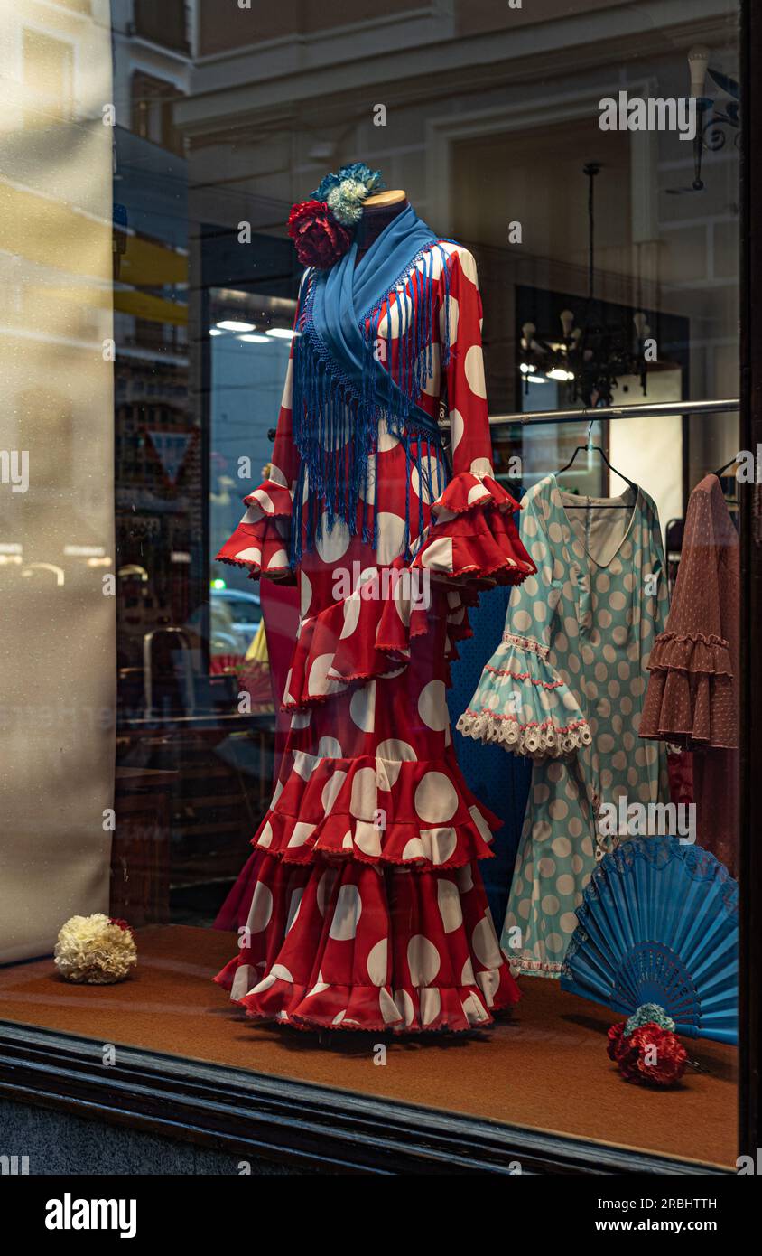 Beautiful spanish flamenco dress in the showcase Stock Photo - Alamy