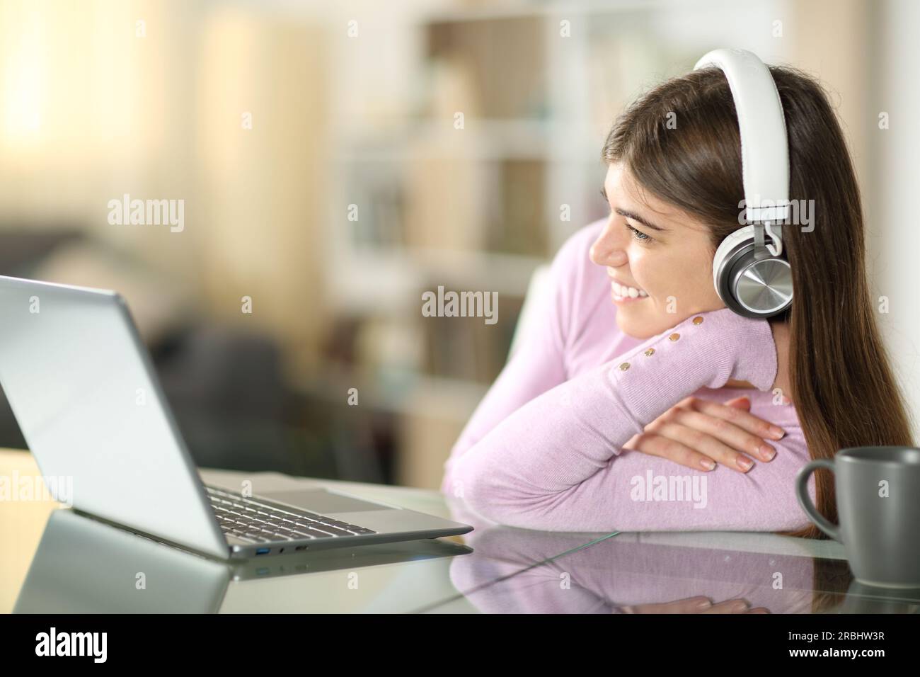 Woman using headphone laughing hi-res stock photography and images - Alamy