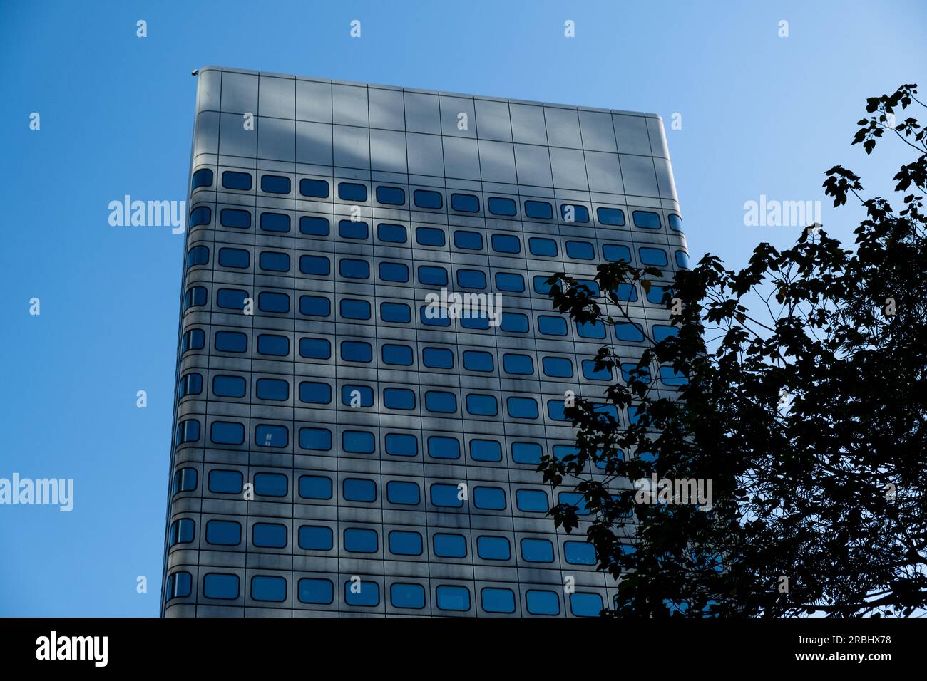 A skyscraper with curved corner windows in the business district of ...