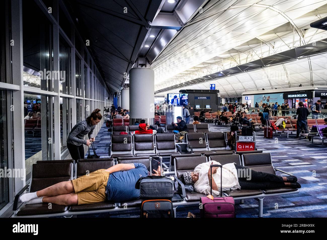 Long layovers and tired passengers sleeping on seats in their clothes ...