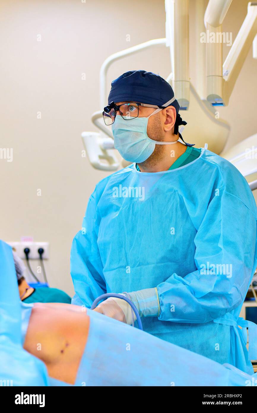 surgeon and the nurse work in the operating room Stock Photo - Alamy