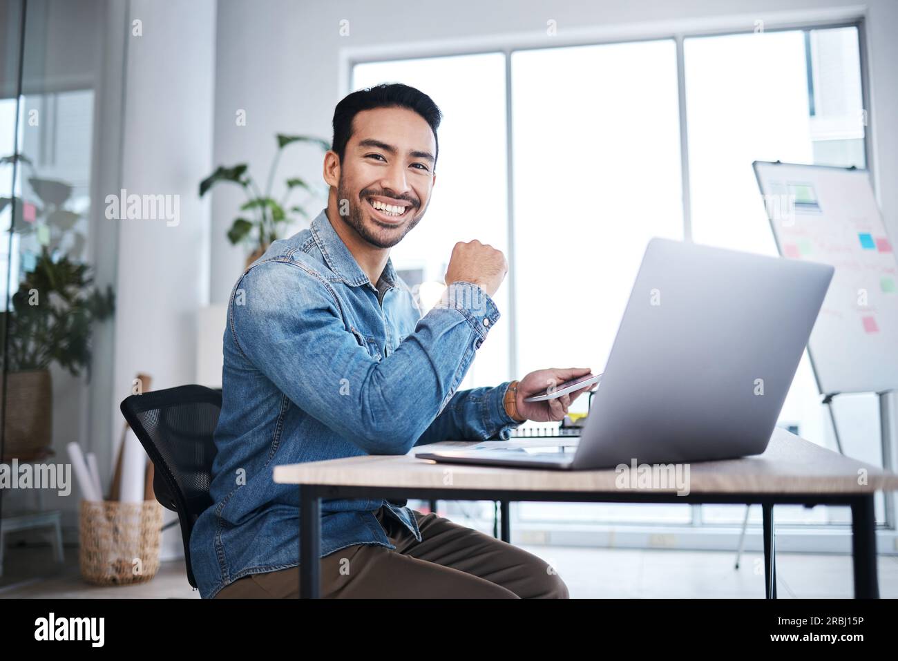 Business man, laptop and smile in startup office, web design or ...
