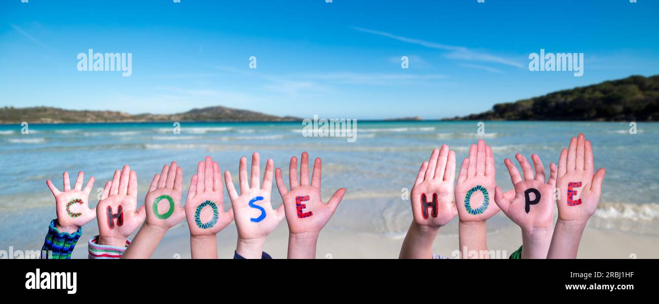 Children Hands Building Word Choose Hope, Ocean And Sea Stock Photo - Alamy