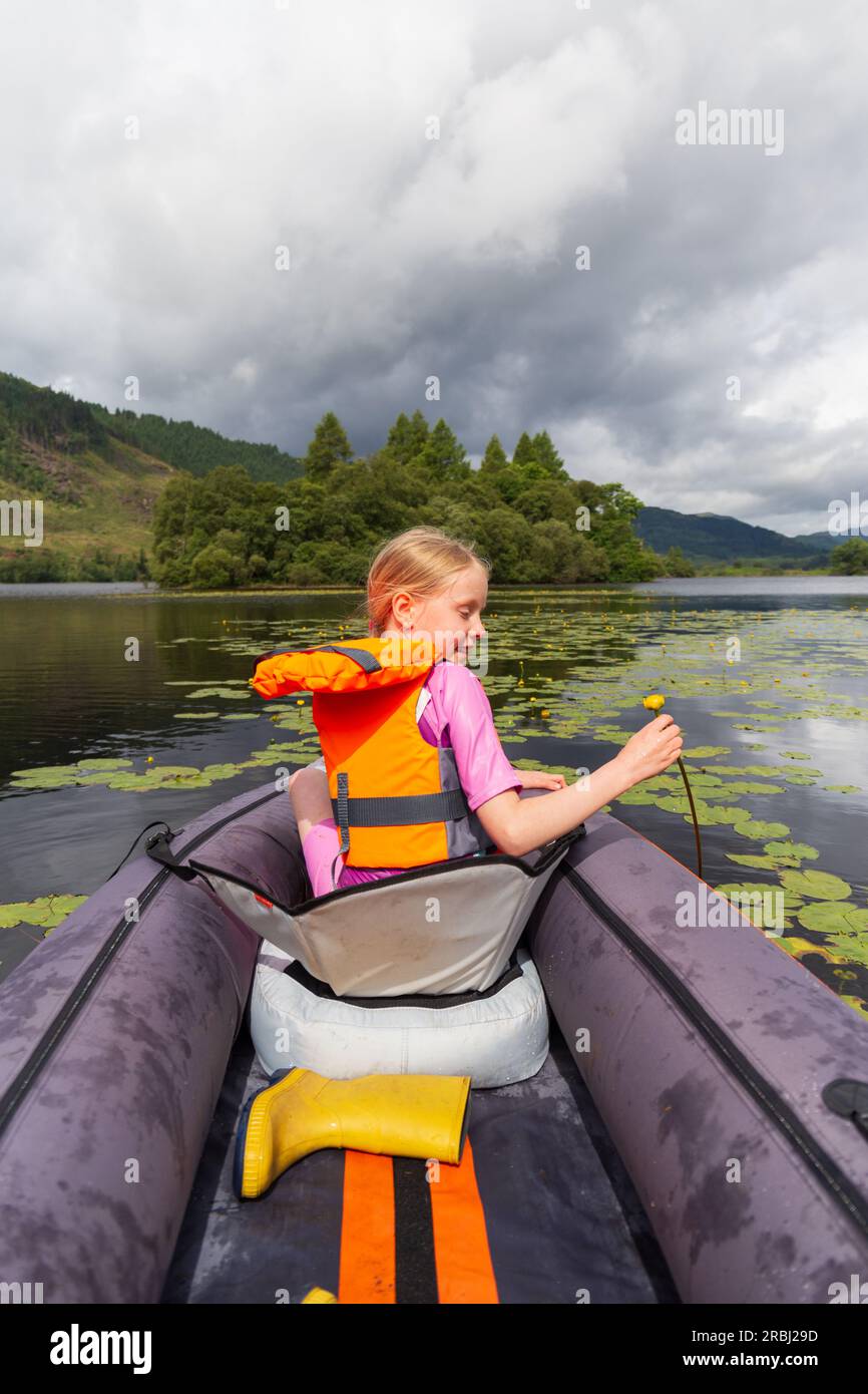 Girl on inflatable boat hi-res stock photography and images - Alamy