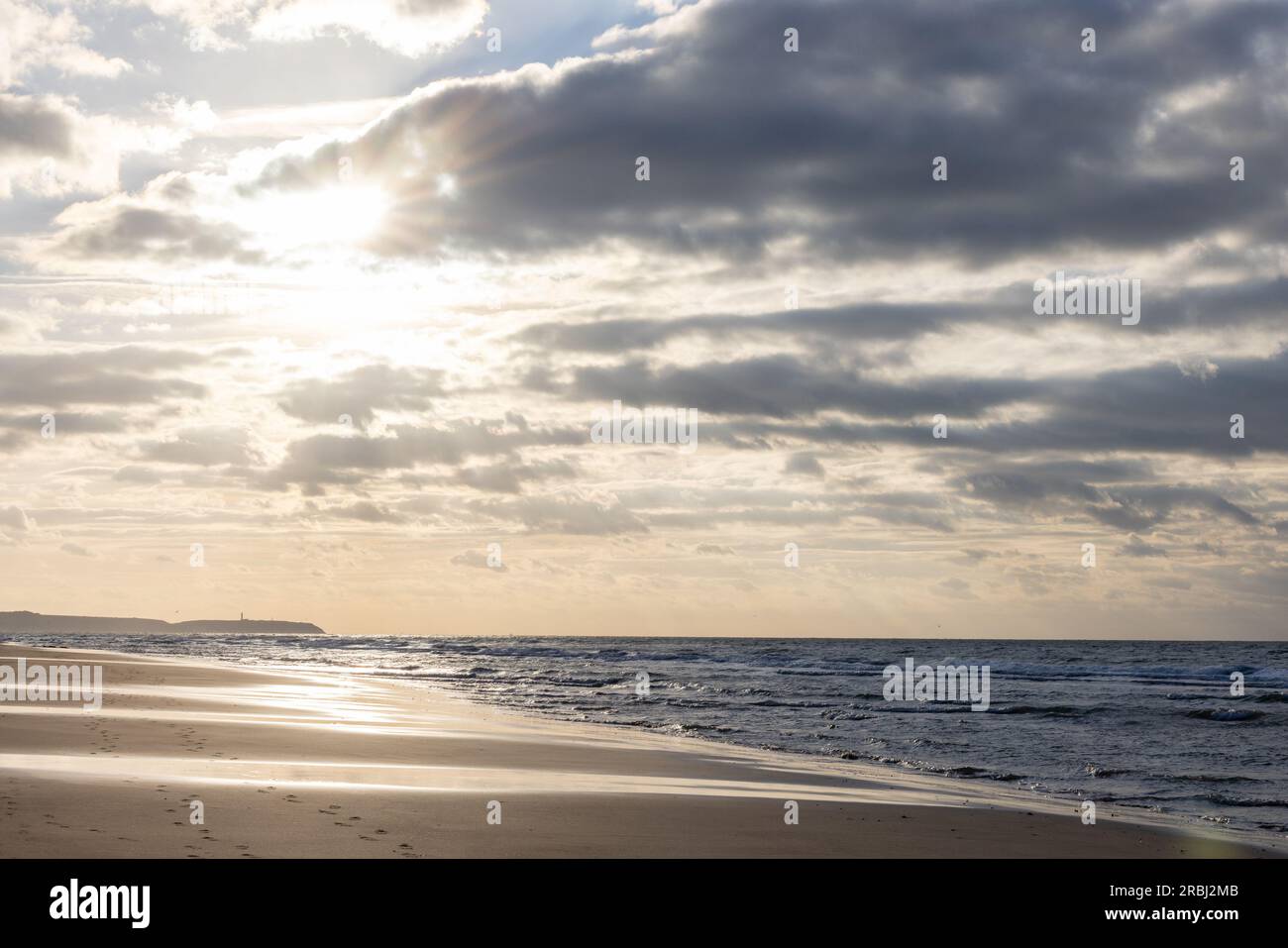 A magnificent capture of a dramatic sunset sky mirrored in the sandy ...