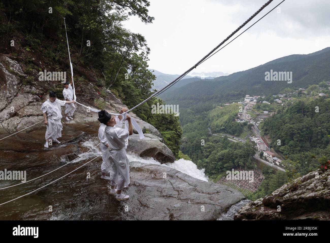 Shinto priests take part in an event to exchange a "shimenawa" sacred ...