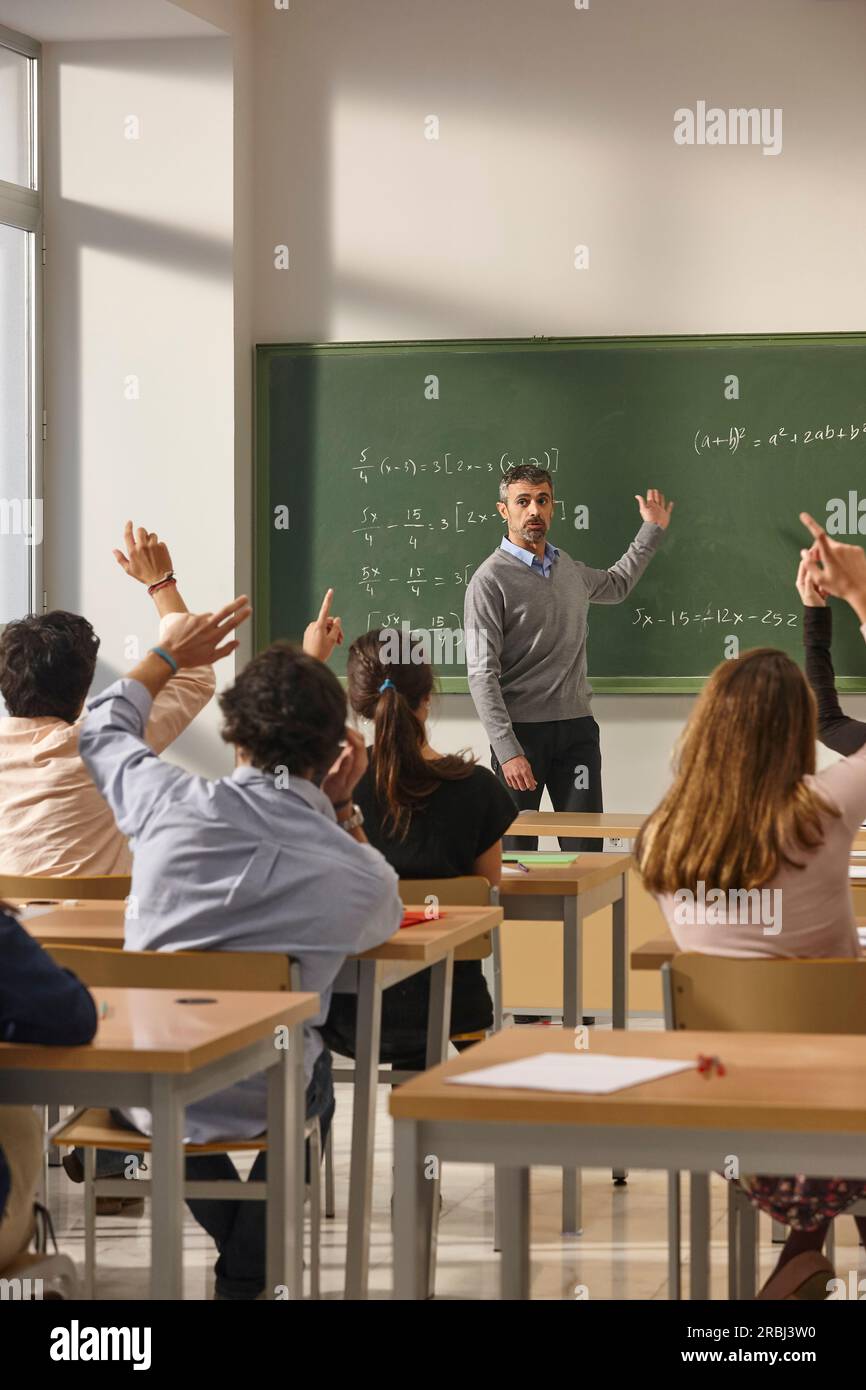 Math teacher giving lessons. Classroom with students. School education ...