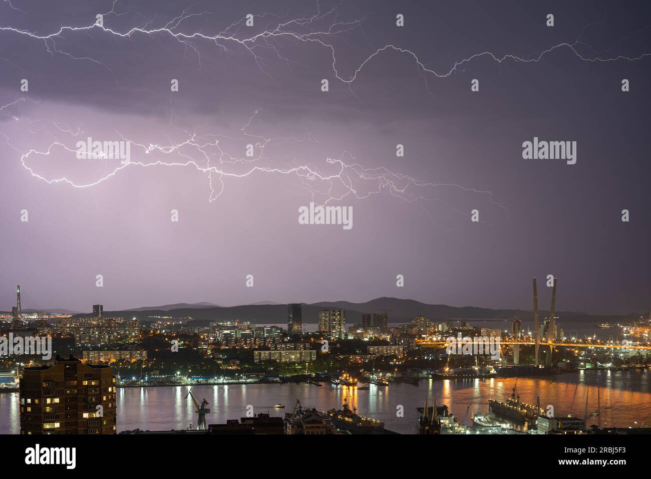 Thunderstorm with lightning over over cityscape Stock Photo - Alamy