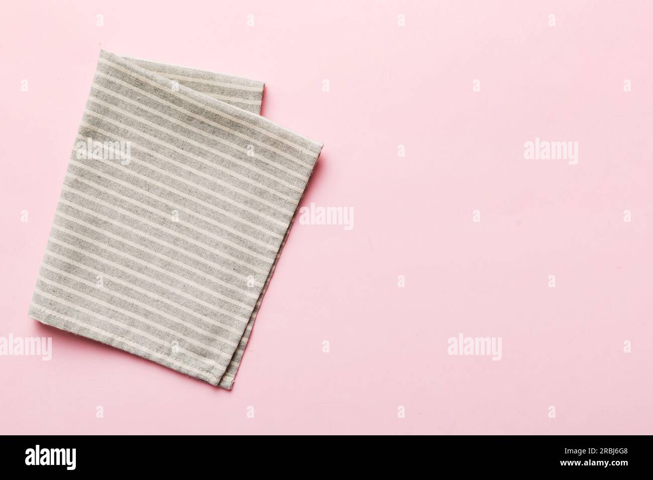 top view with gray kitchen napkin isolated on table background. Folded ...