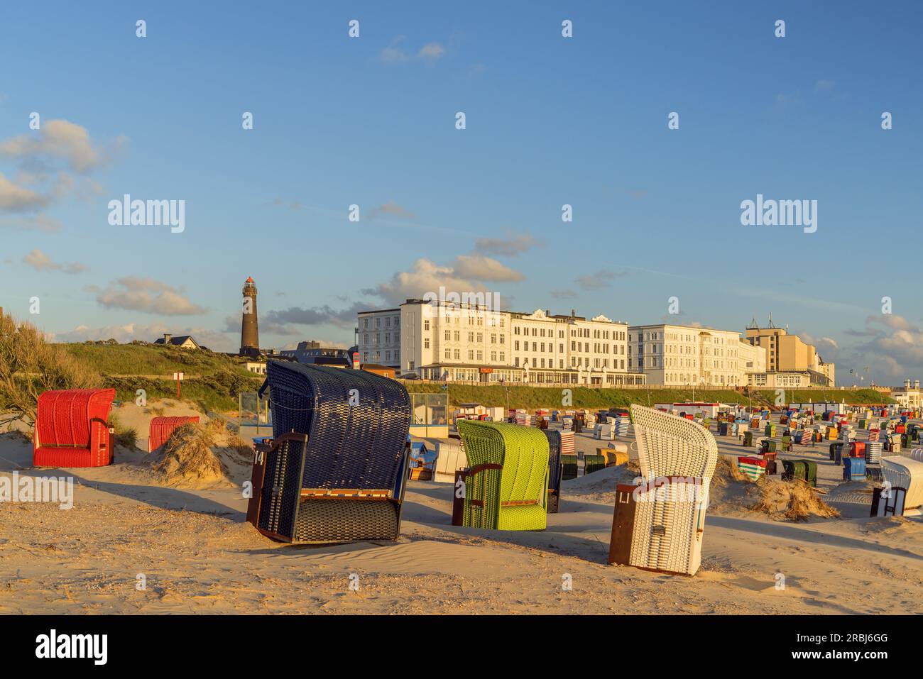 Beach, new lighthouse and houses, Borkum Island, Lower Saxony, Germany ...