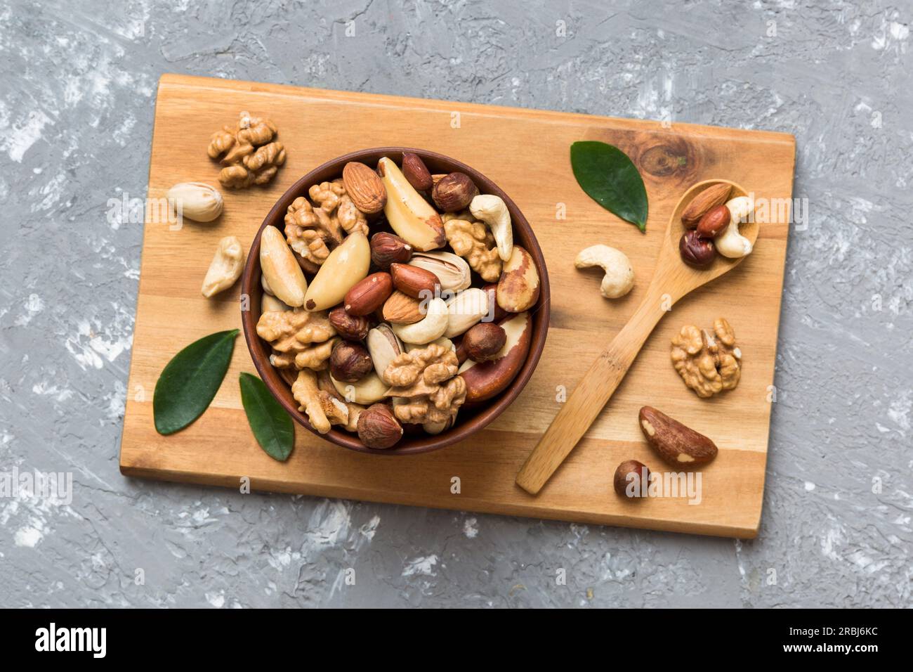 mixed nuts in bowl. Mix of various nuts on colored background ...