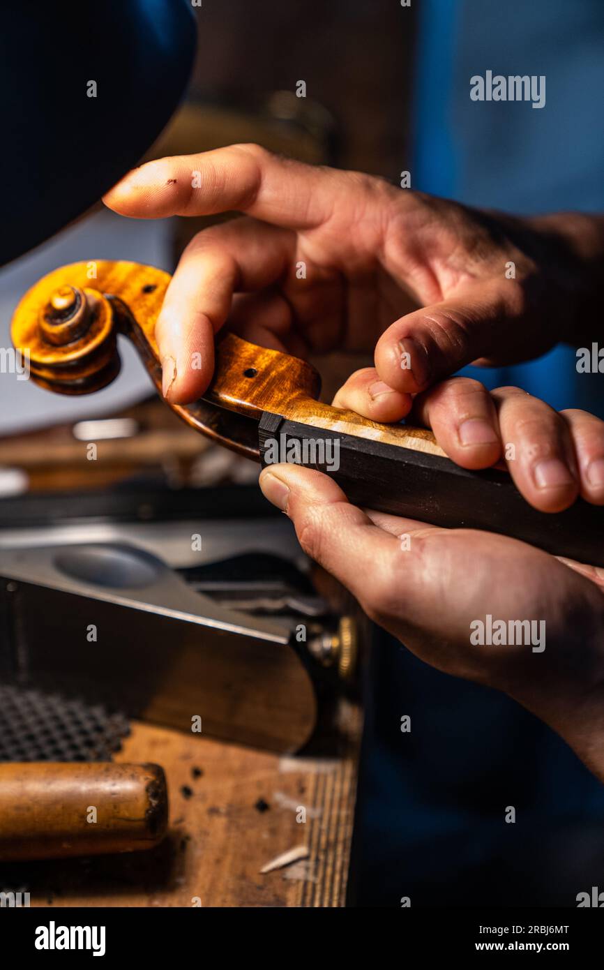Violin maker working in his workshop - wood work - craftsman - artist ...