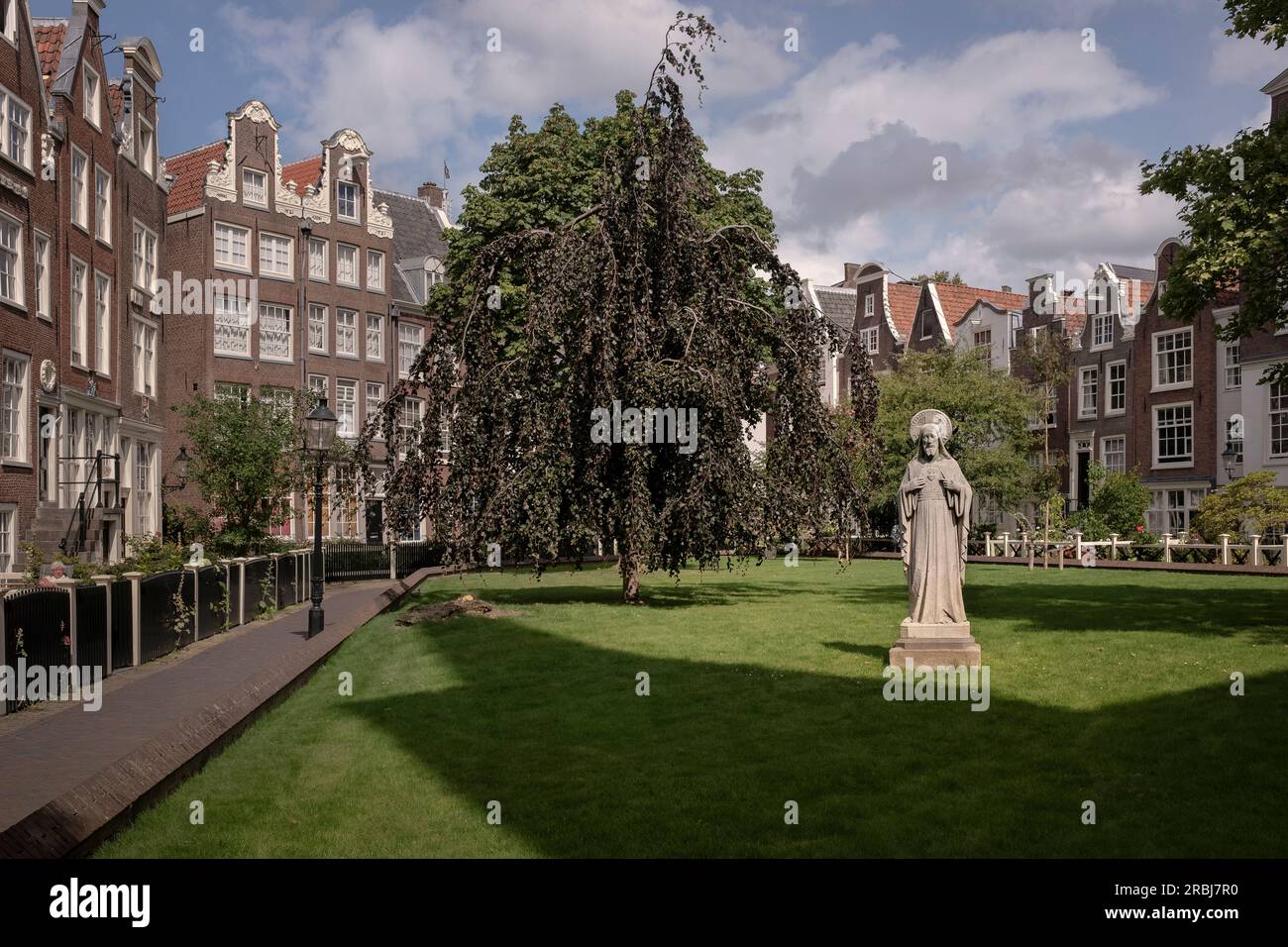 Courtyard with statue and typical architecture, Amsterdam, province of ...