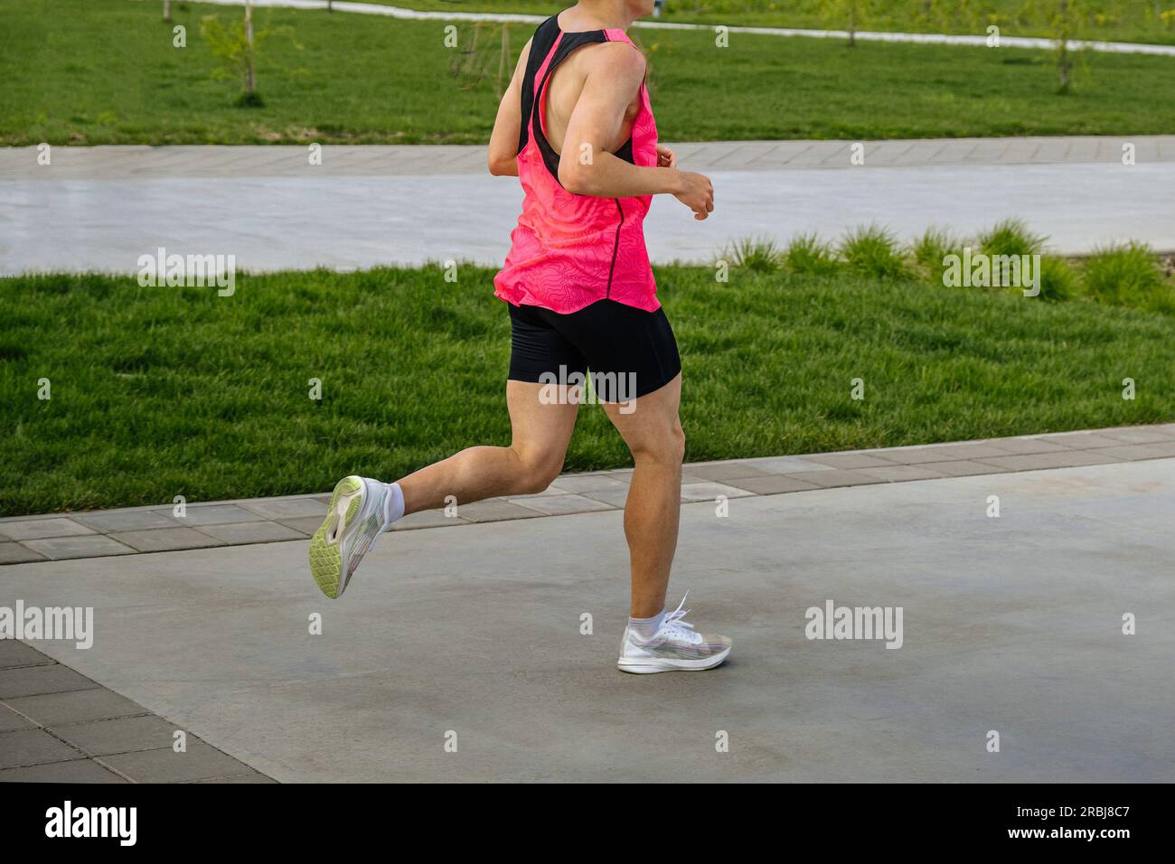 male athlete runner running marathon race in landscape park, summer ...