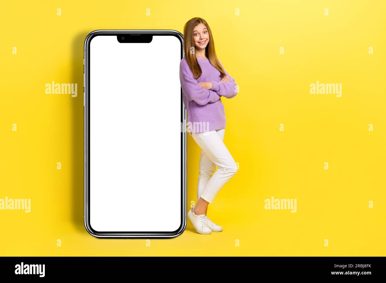 Full length photo of positive lady arm crossed stand big modern device ...