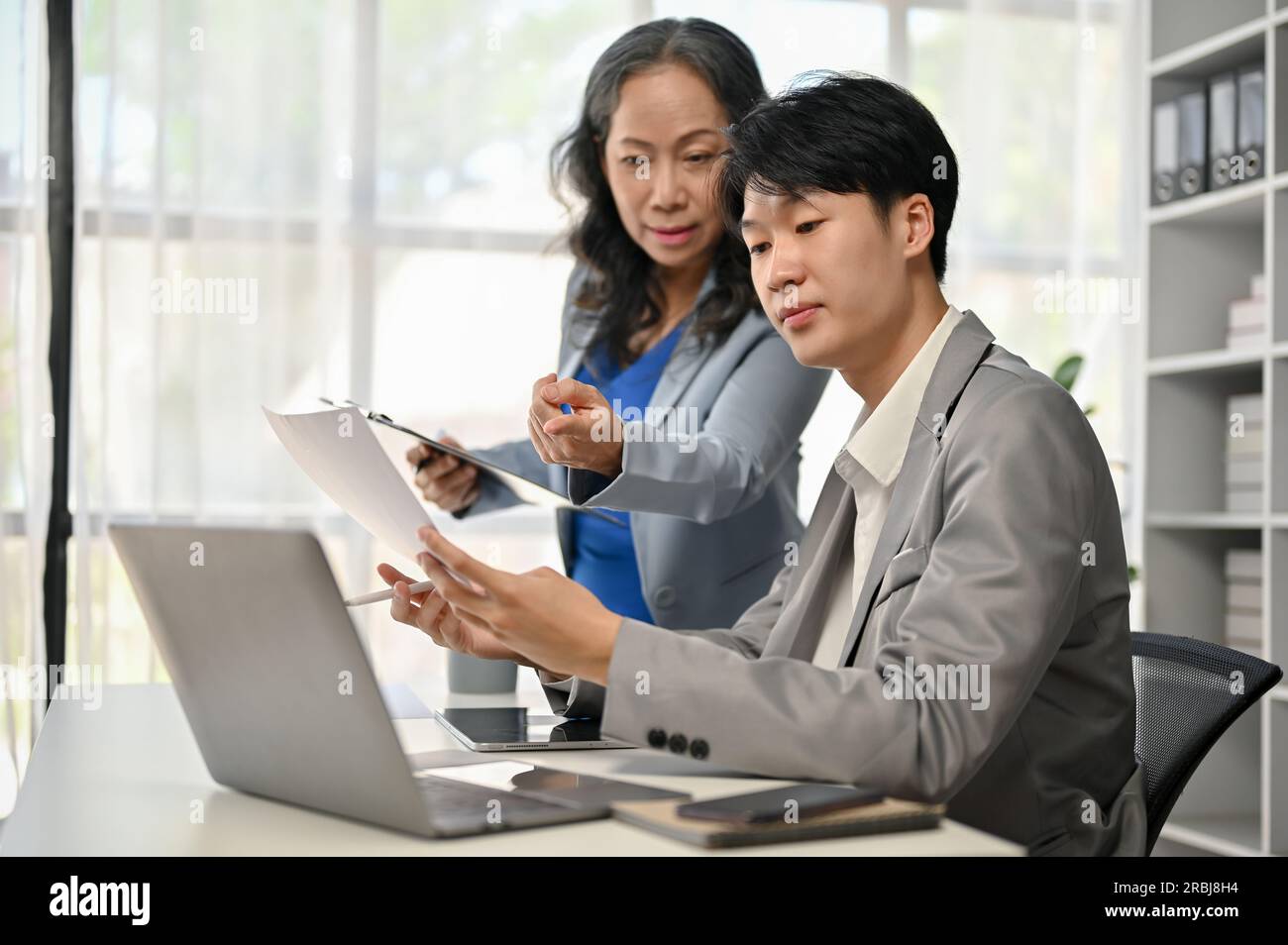 A professional Asian senior female boss is planning, brainstorming, and ...