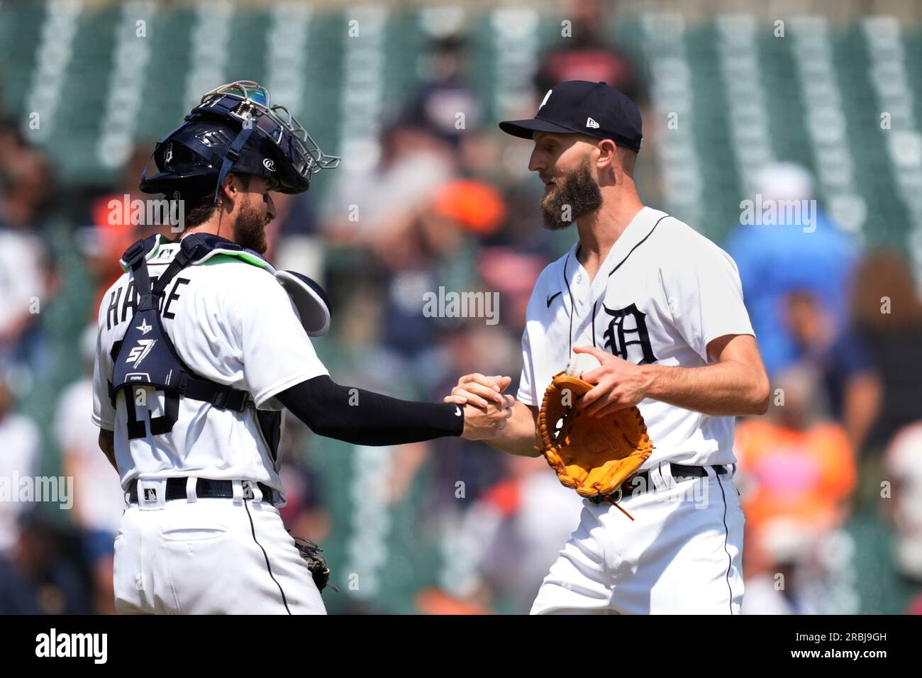 Detroit Tigers catcher Eric Haase (13) greets relief pitcher Chasen ...