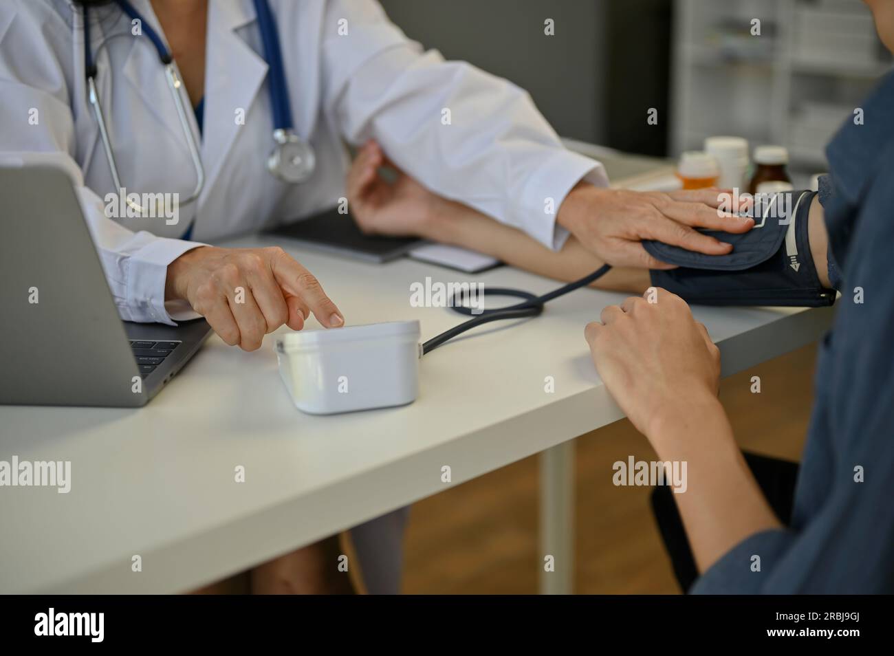 Close-up image of a female doctor is measuring a patient's blood ...
