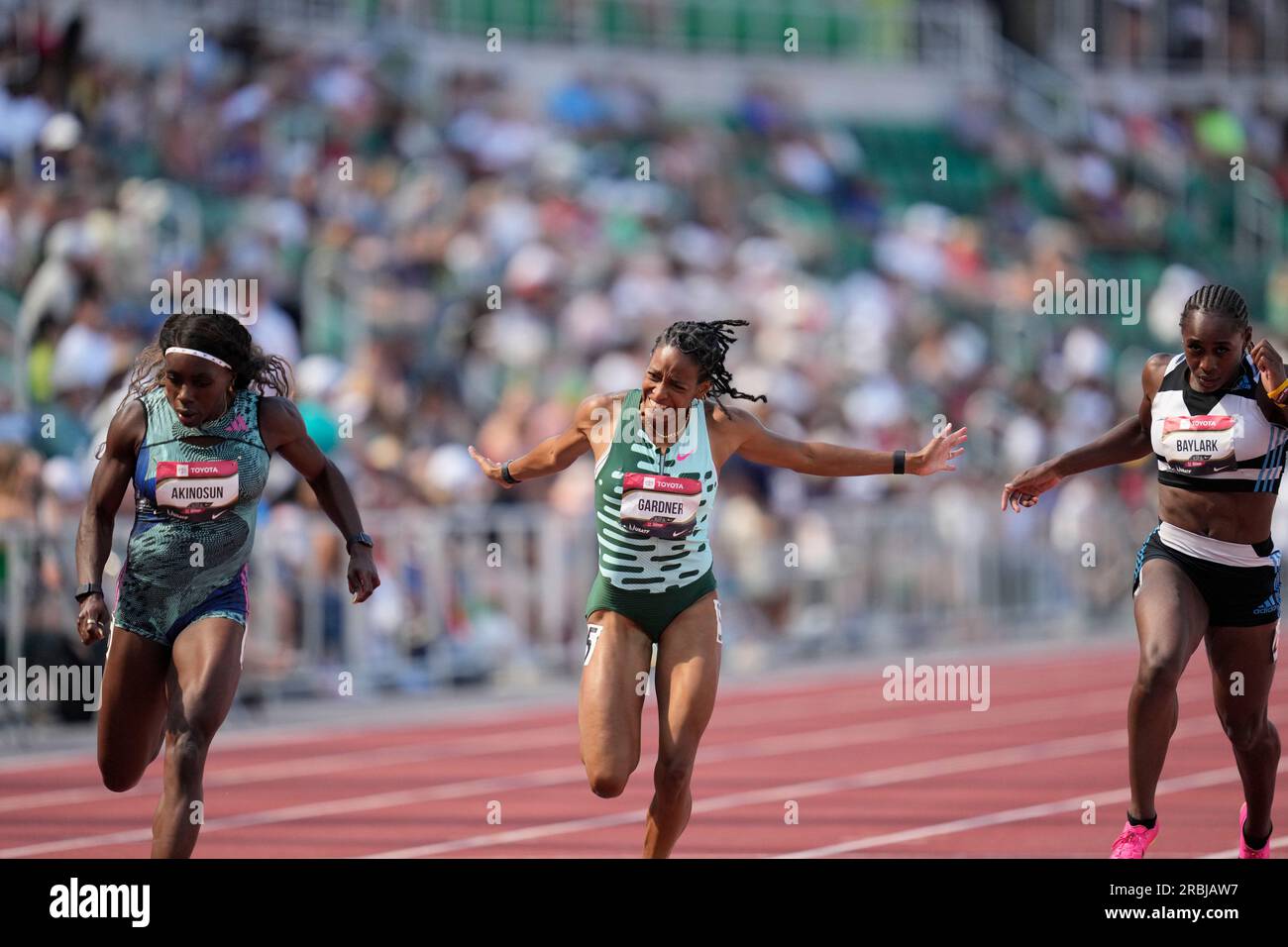 Morolake Akinosun, right, wins her heat in a women's 100 meter ...