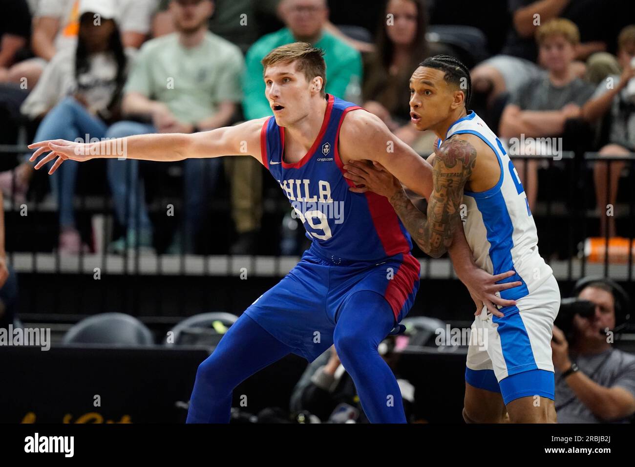 Oklahoma City Thunder guard Tre Mann, right, defends against Philadelphia 76ers forward Azuolas ...