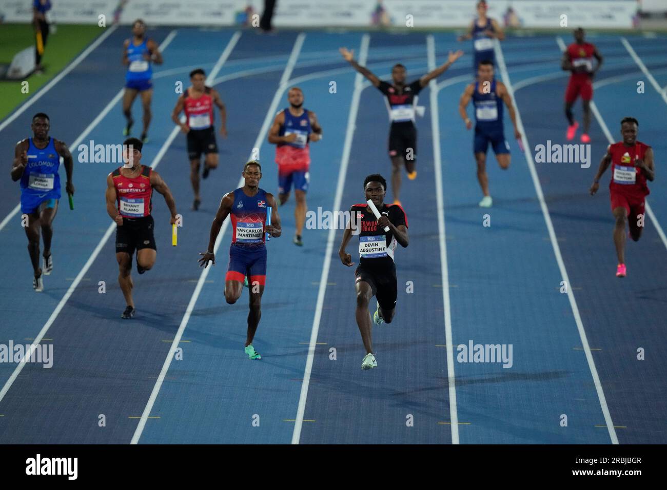 Athletes compete in the men's athletics 4 x 100-meter relay final of ...