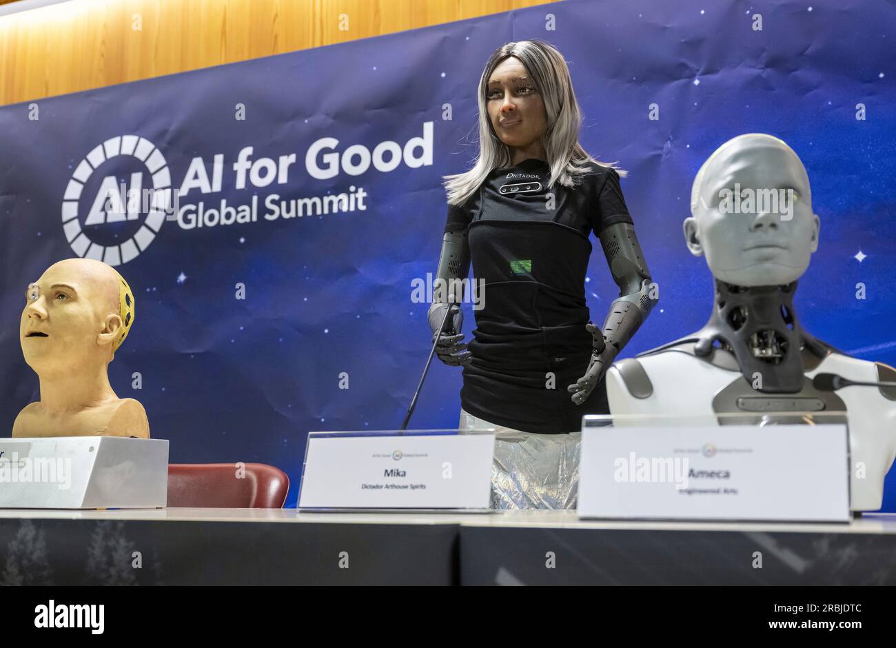 Robots are seen on the podium during a press conference with a panel of ...
