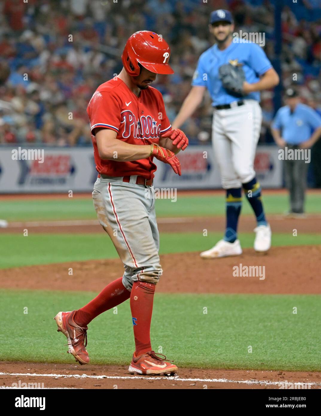 Philadelphia Phillies catcher Garrett Stubbs, left, takes his base ...