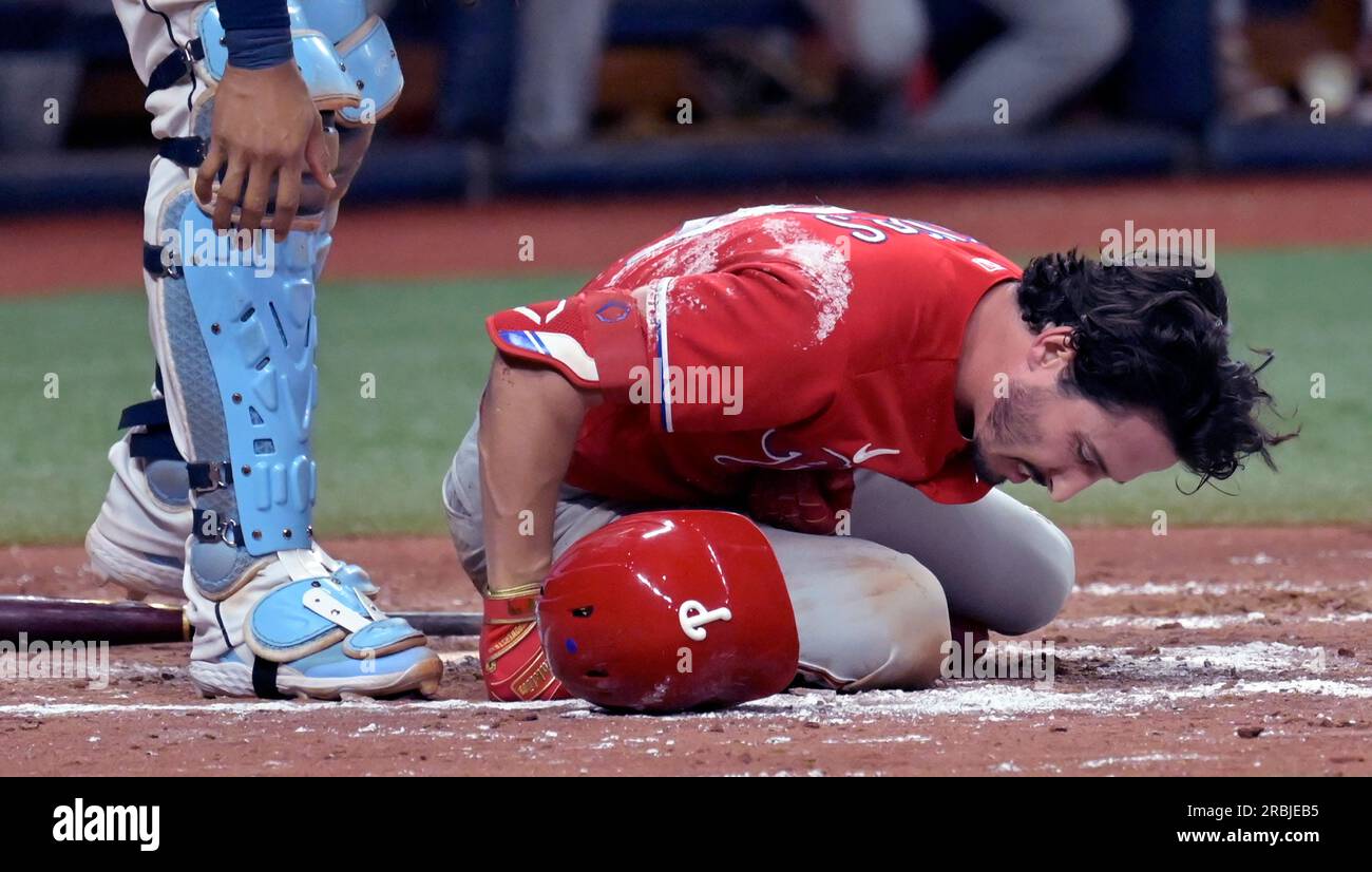 Philadelphia Phillies Garrett Stubbs grimaces after getting hit by a ...