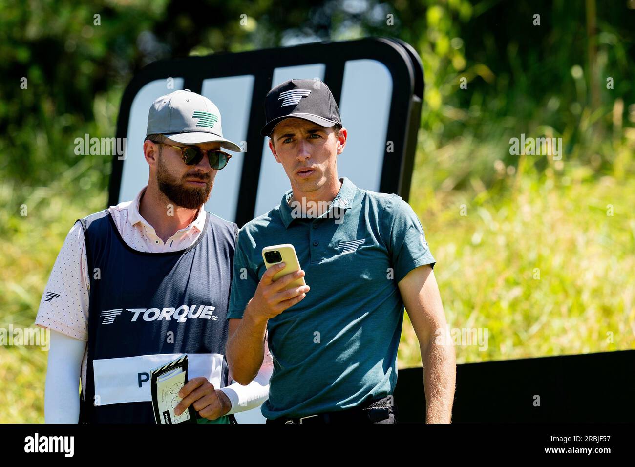 David Puig of Torque GC and his caddie on the 14th hole before the ...