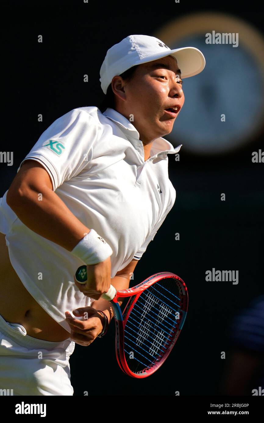 China's Bai Zhuoxuan serves to Tunisia's Ons Jabeur during the women's ...
