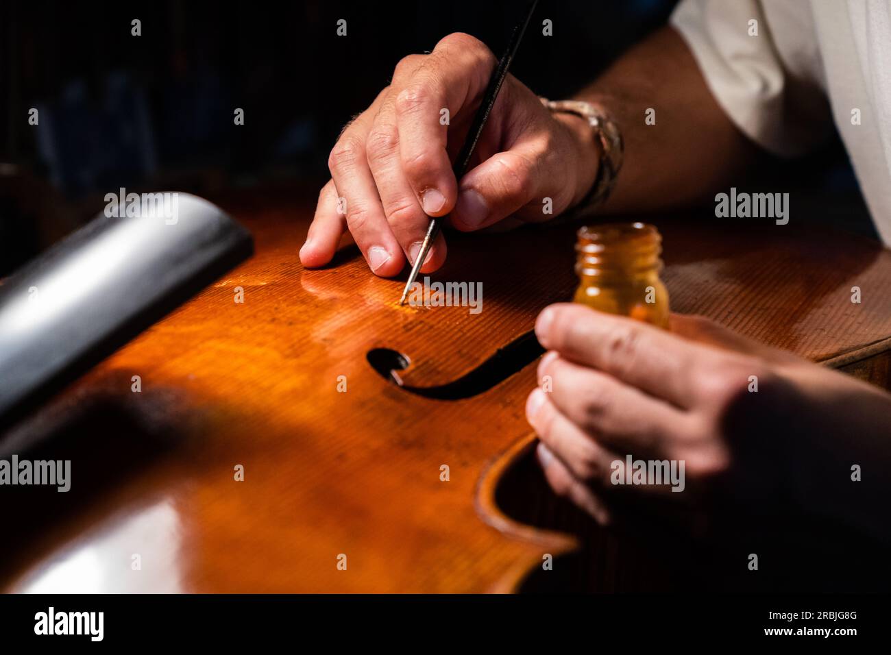 Violin maker working in his workshop - wood work - craftsman - artist ...